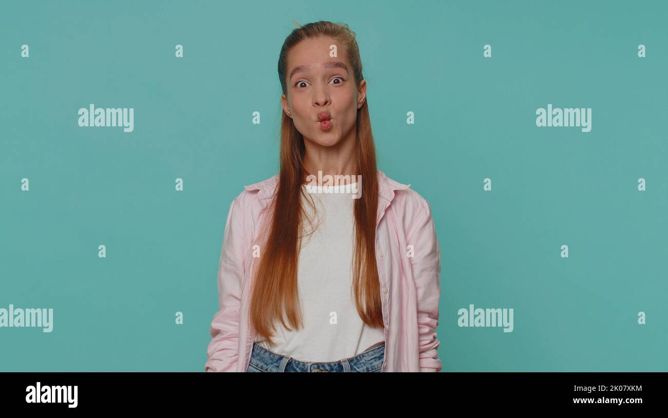 Lovely pretty funny girl in shirt making playful silly facial ...
