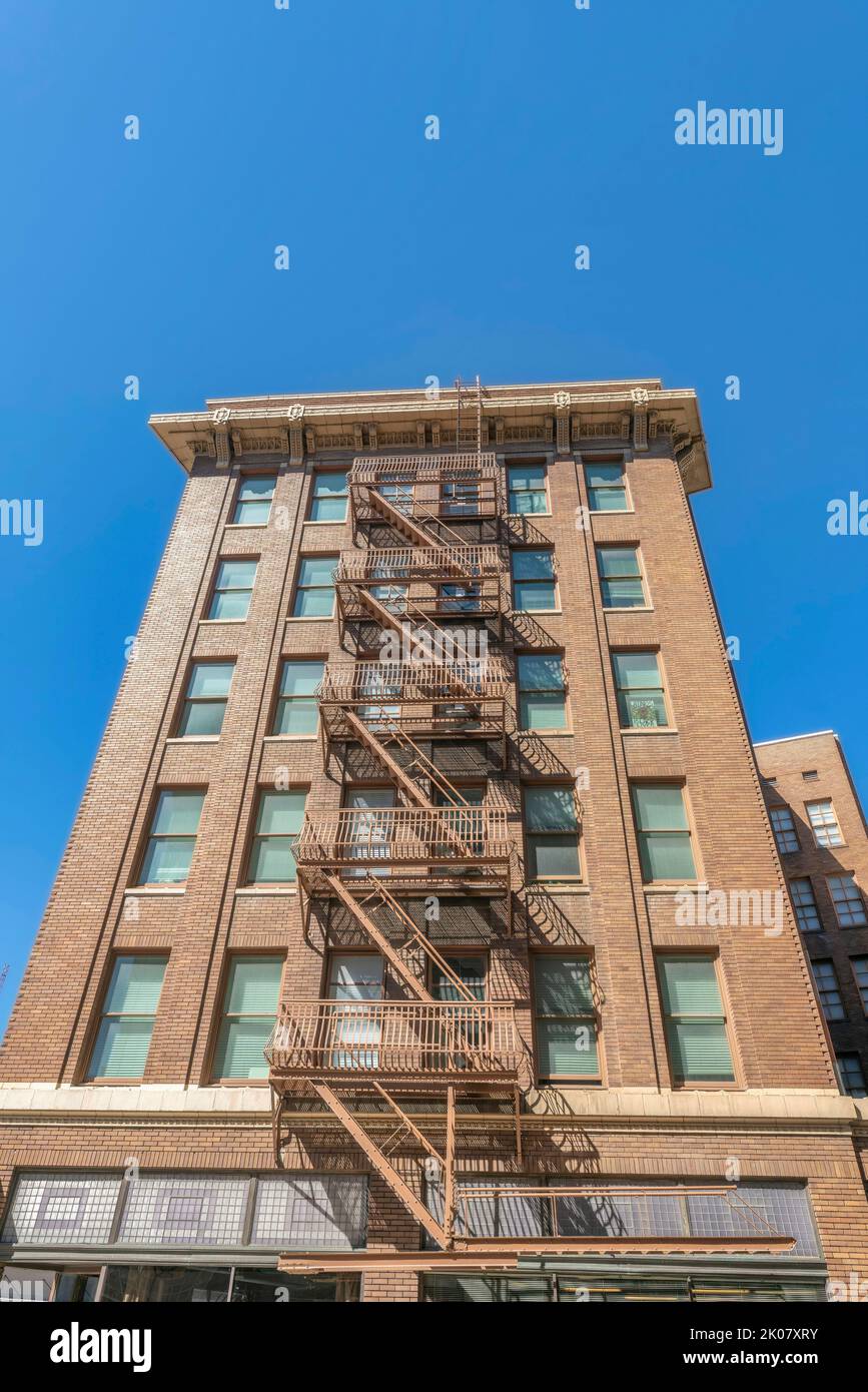 Exterior of an apartment with flight of stairs for fire exit against ...