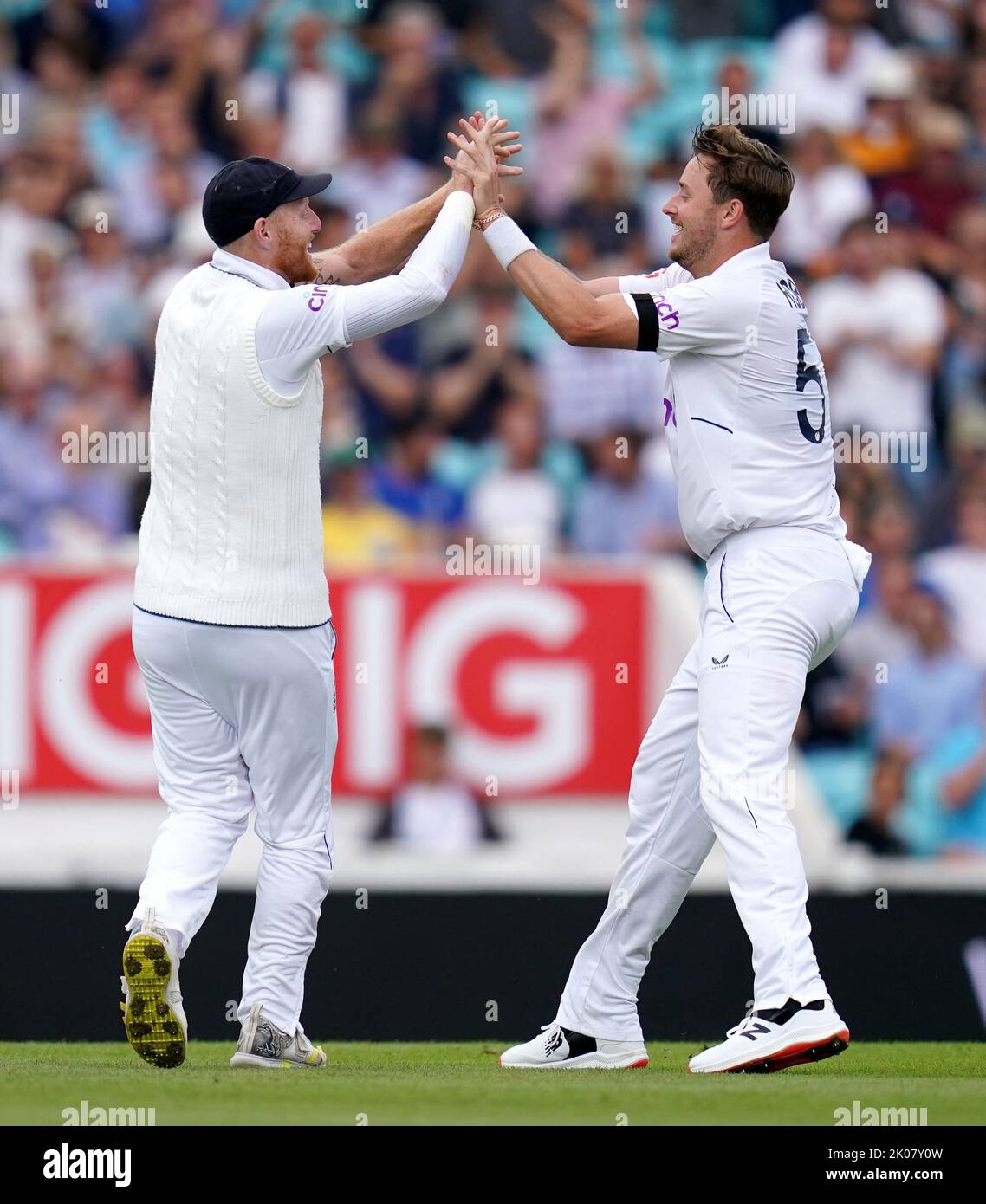 England's Ollie Robinson (right) celebrates with captain Ben Stokes ...