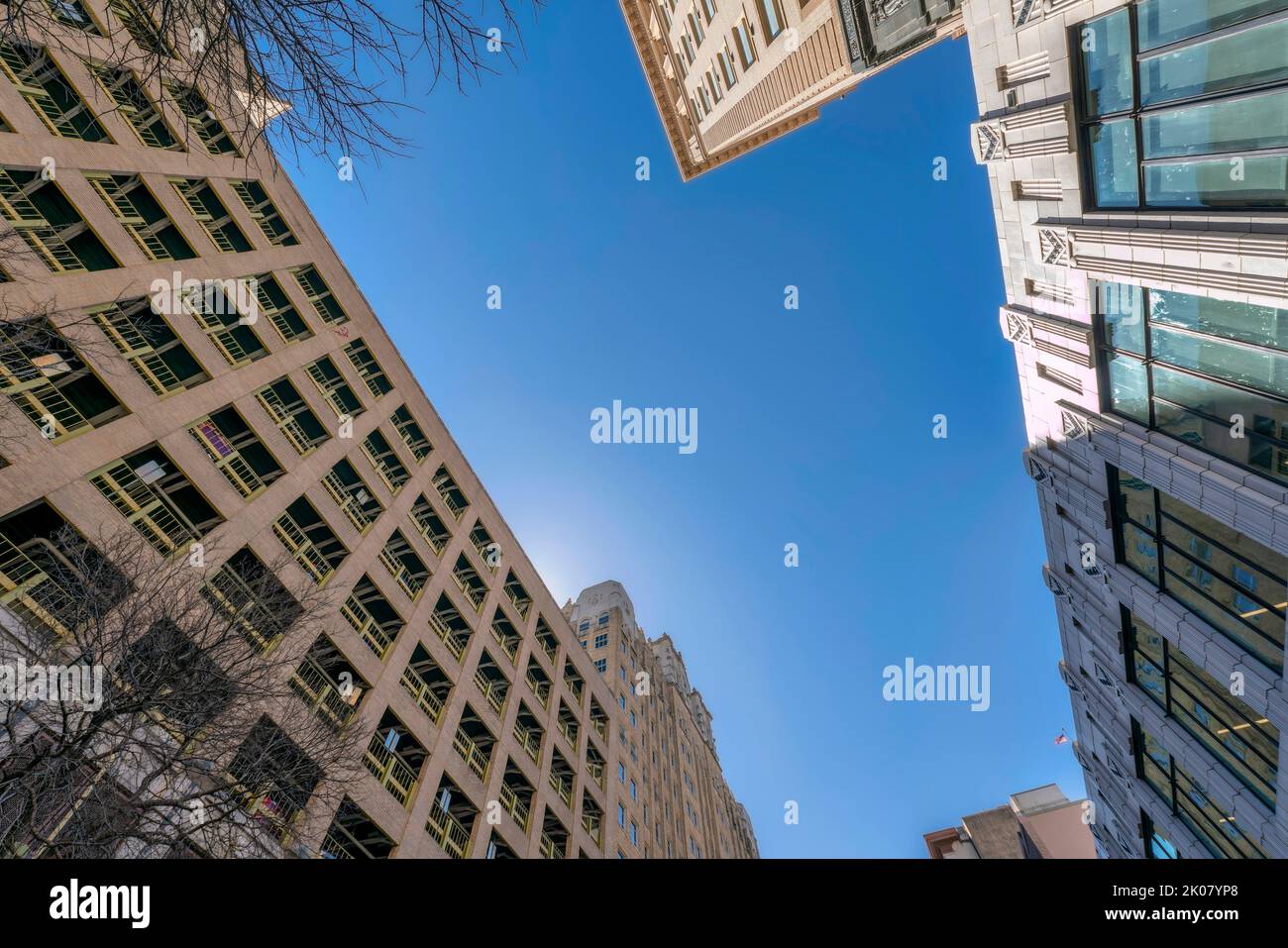 Looking up at a multi level parking lot and a building in San Antonio ...