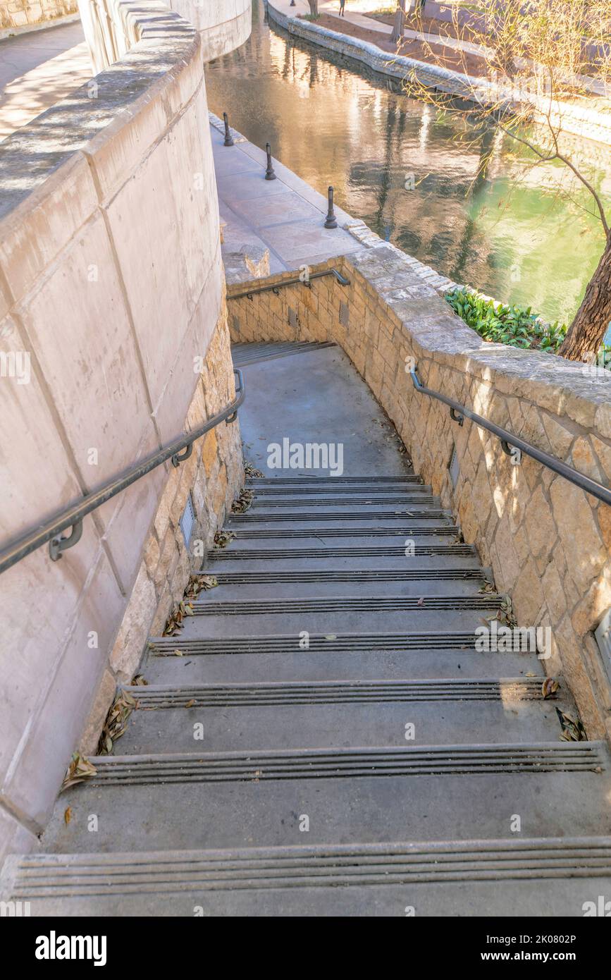 Stairs from the bridge going down the pathway along San Antonio River ...