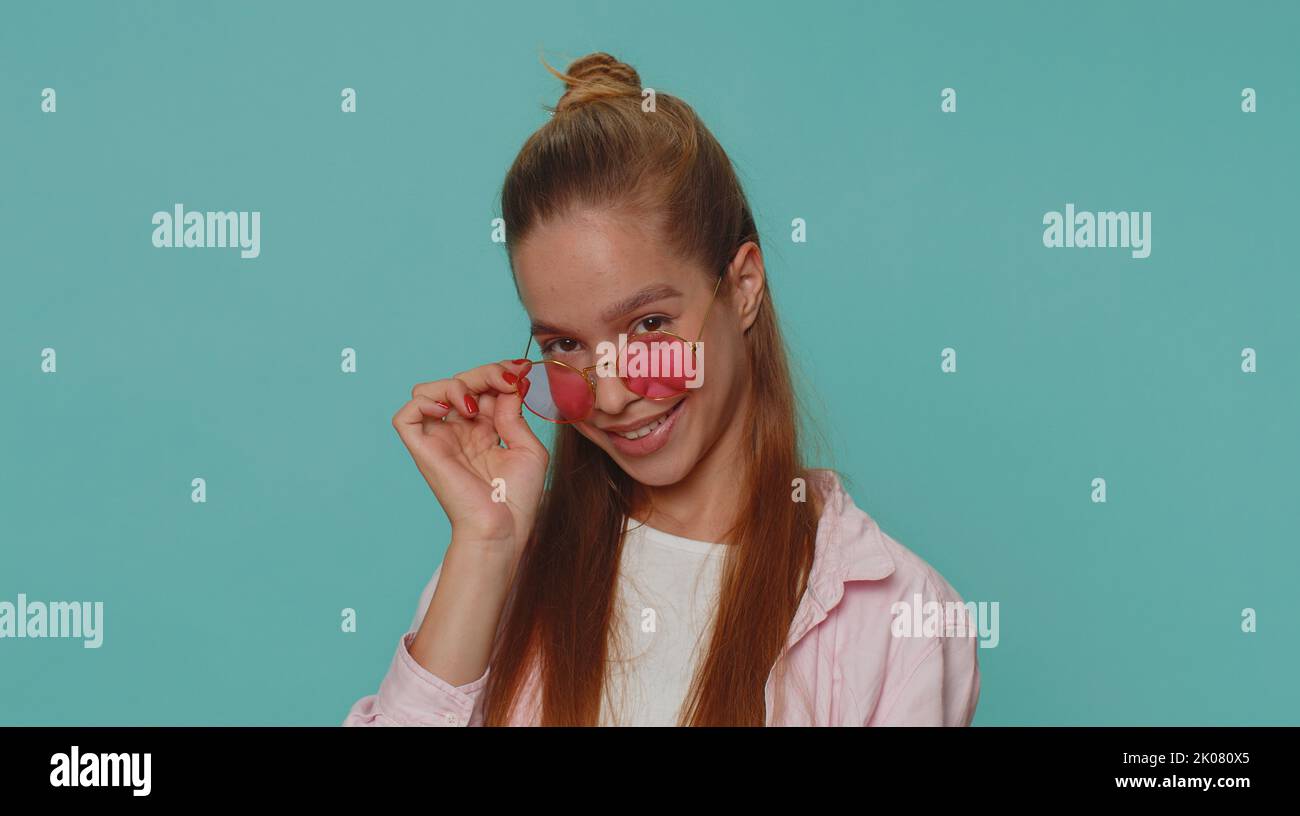 Portrait of seductive pretty teenager child kid wearing sunglasses ...