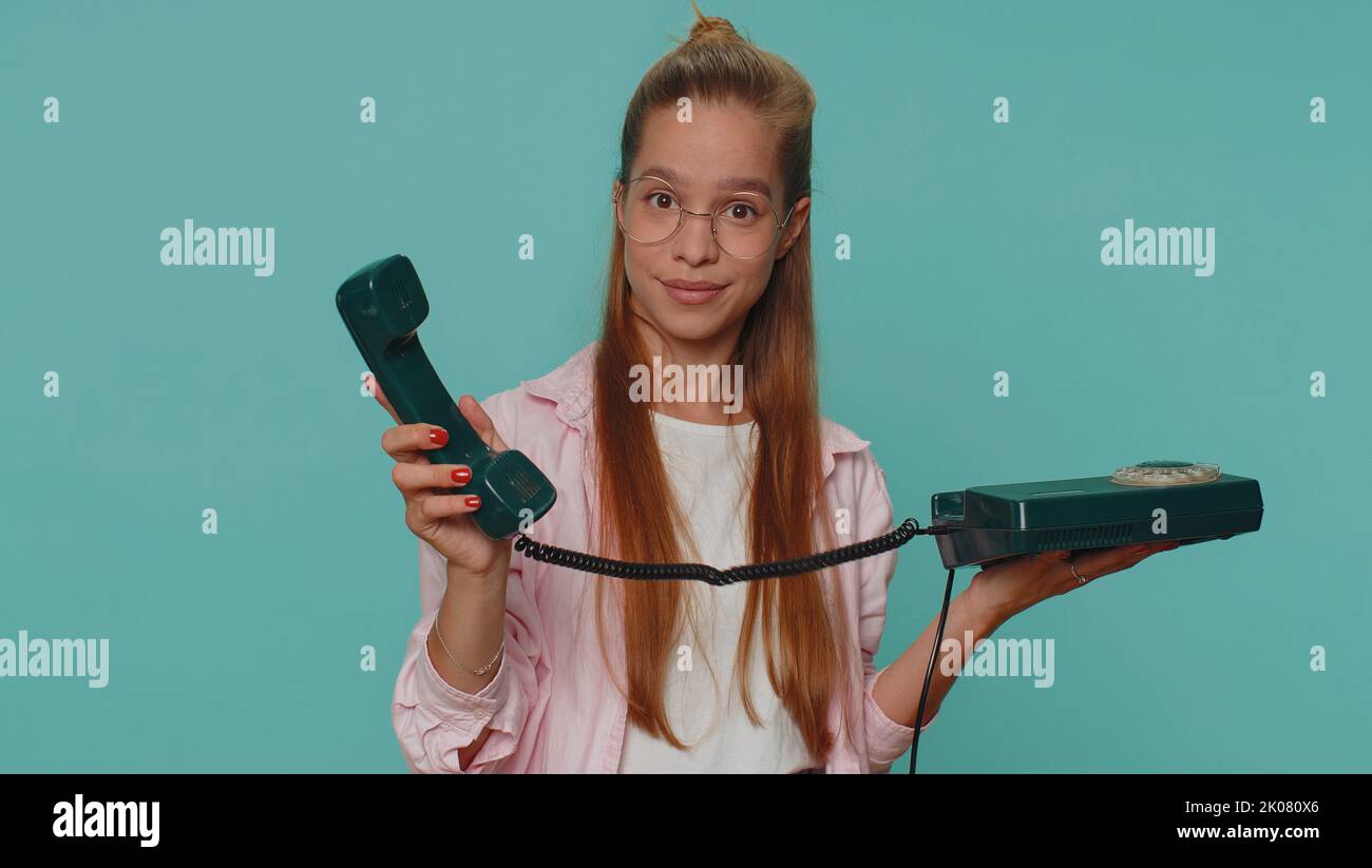 Hey you, call me back. Pretty teenager girl child kid talking on wired ...