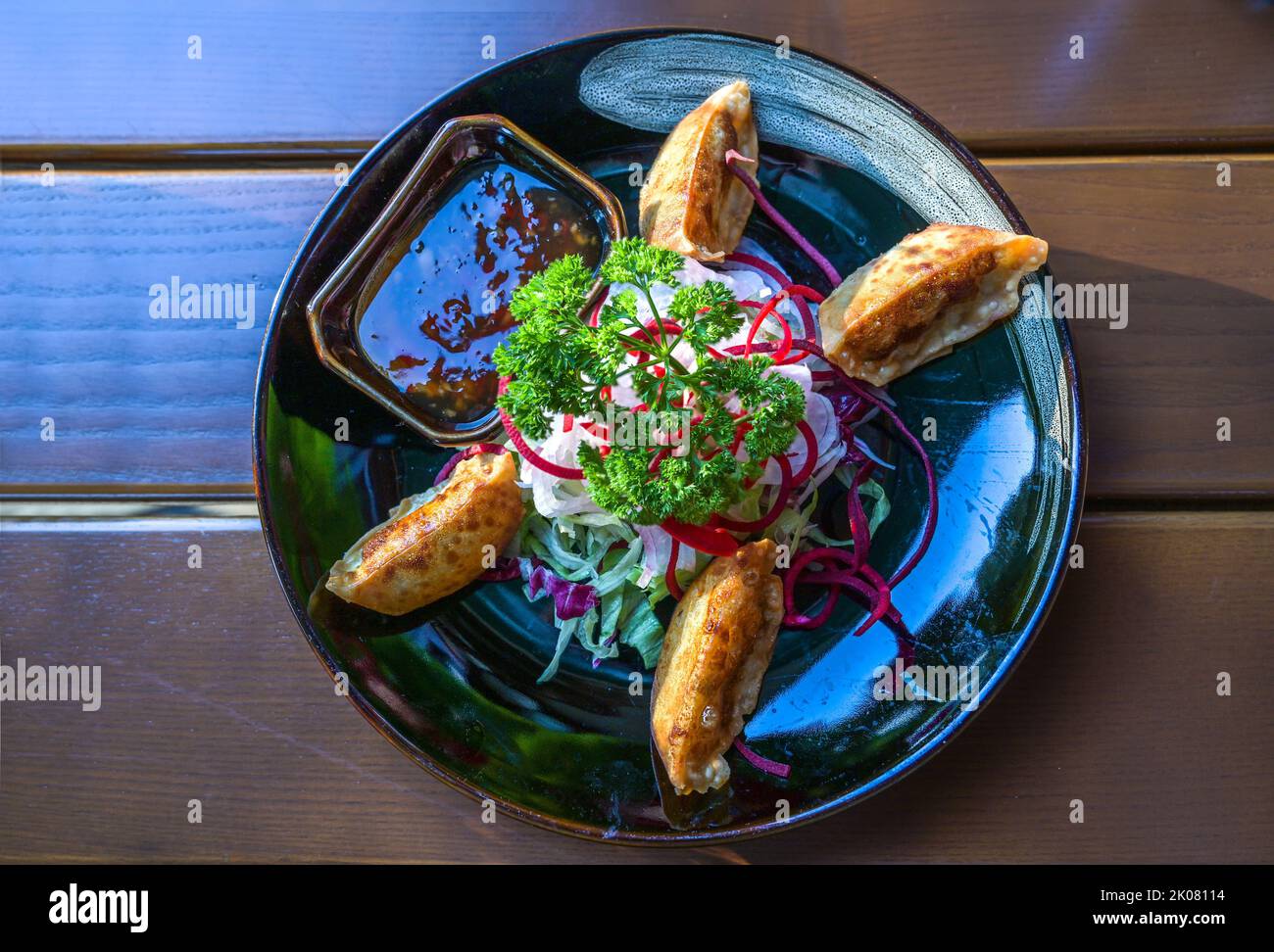 Deep fried Asian dumplings, Japanese gyoza or Chinese jiaozi, served ...