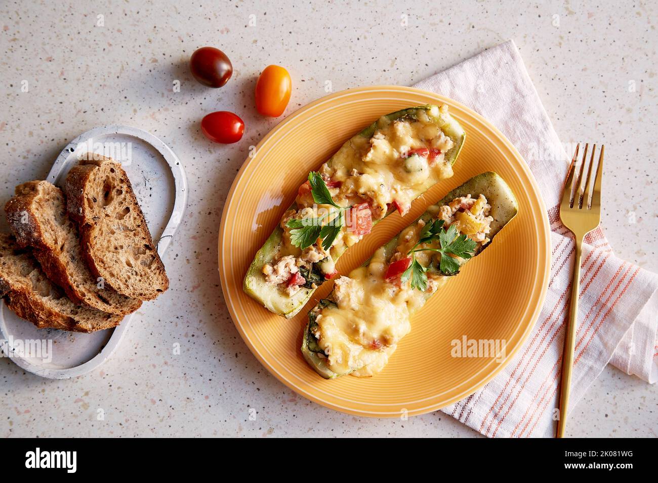 Stuffed baked courgettes zucchini with meat, mozzarella, tomatoes ...