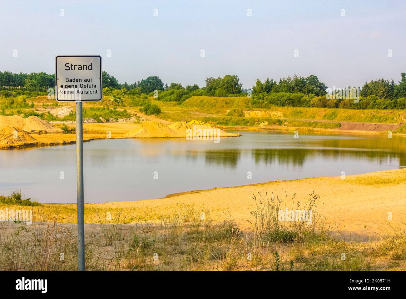 Beautiful lake river water beach with sand and sand hill forest and ...