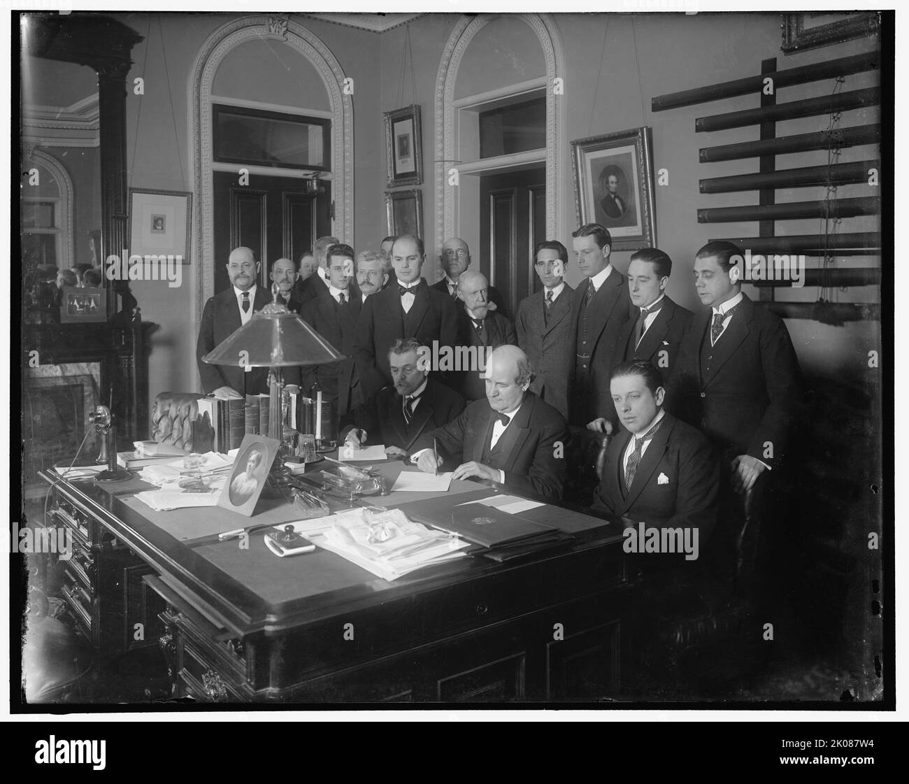 William Jennings Bryan with group at desk, between 1910 and 1920. Bryan ...