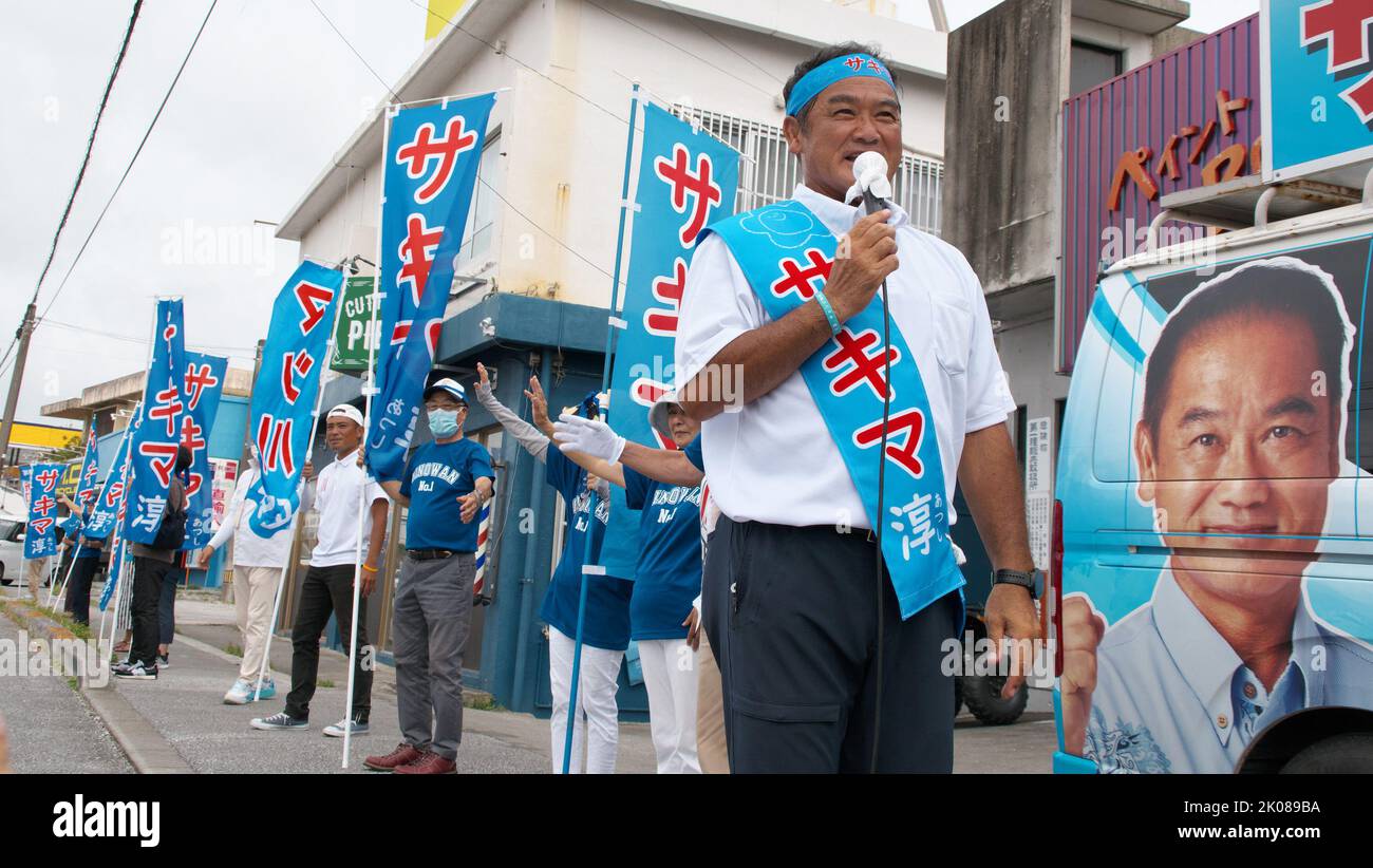 Naha, Japan. 10th Sep, 2022. Candidate Atsushi Sakima delivers speech ...