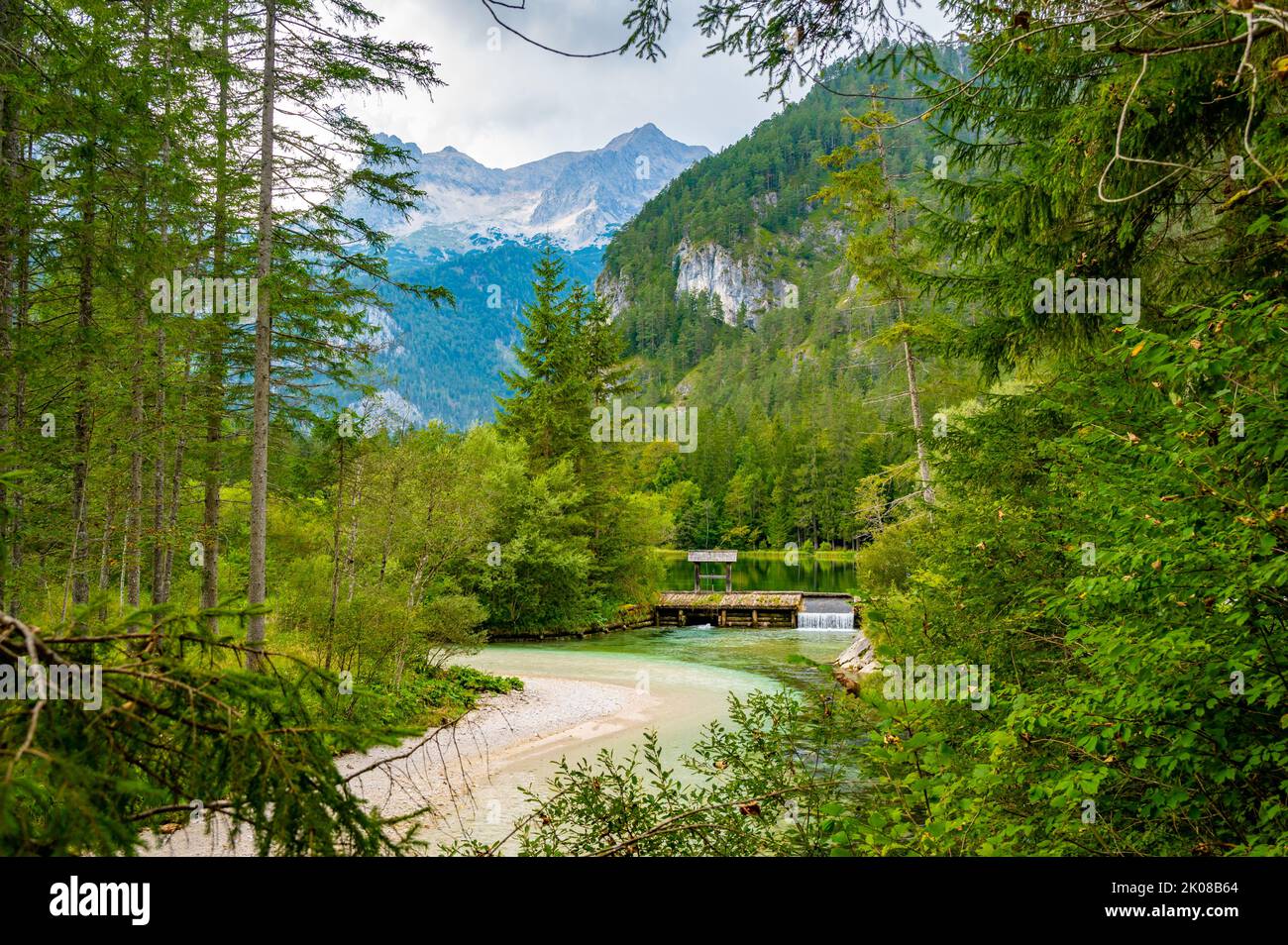 Famous green lake Schiederweiher near village Hinterstoder. Small weir ...