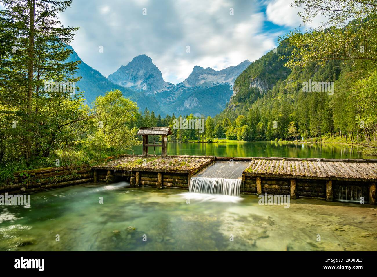 Famous green lake Schiederweiher near village Hinterstoder. Small weir ...