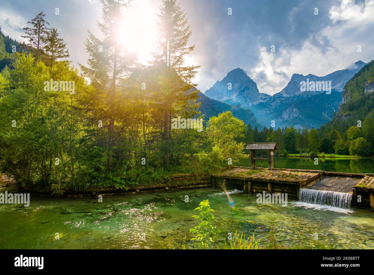 Famous green lake Schiederweiher near village Hinterstoder. Small weir ...