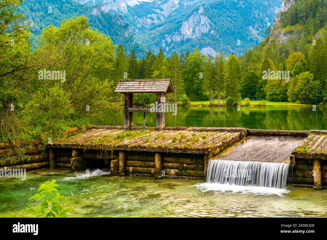 Famous green lake Schiederweiher near village Hinterstoder. Small weir ...