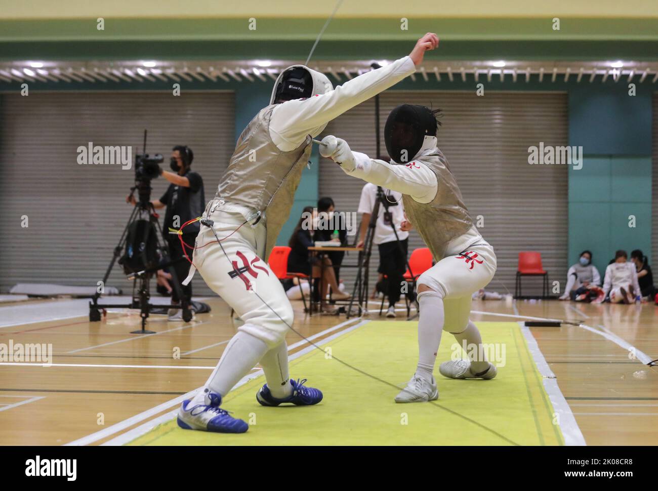 Ryan Choi Chun-yin (black helmet) against Cheng Tit-nam at men's final ...