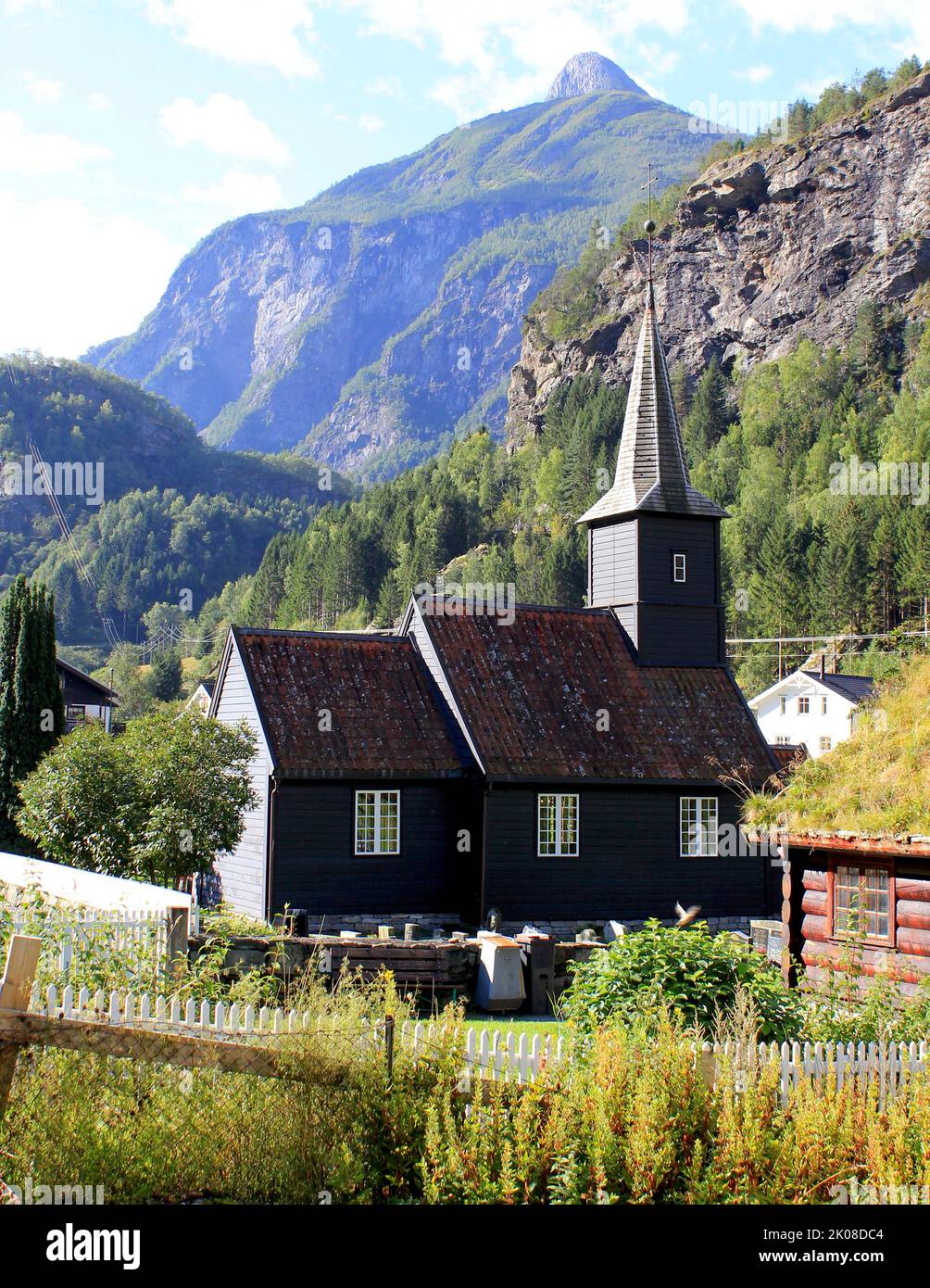 The wooden church set in the beautiful fjord valley in Flam in Norway ...