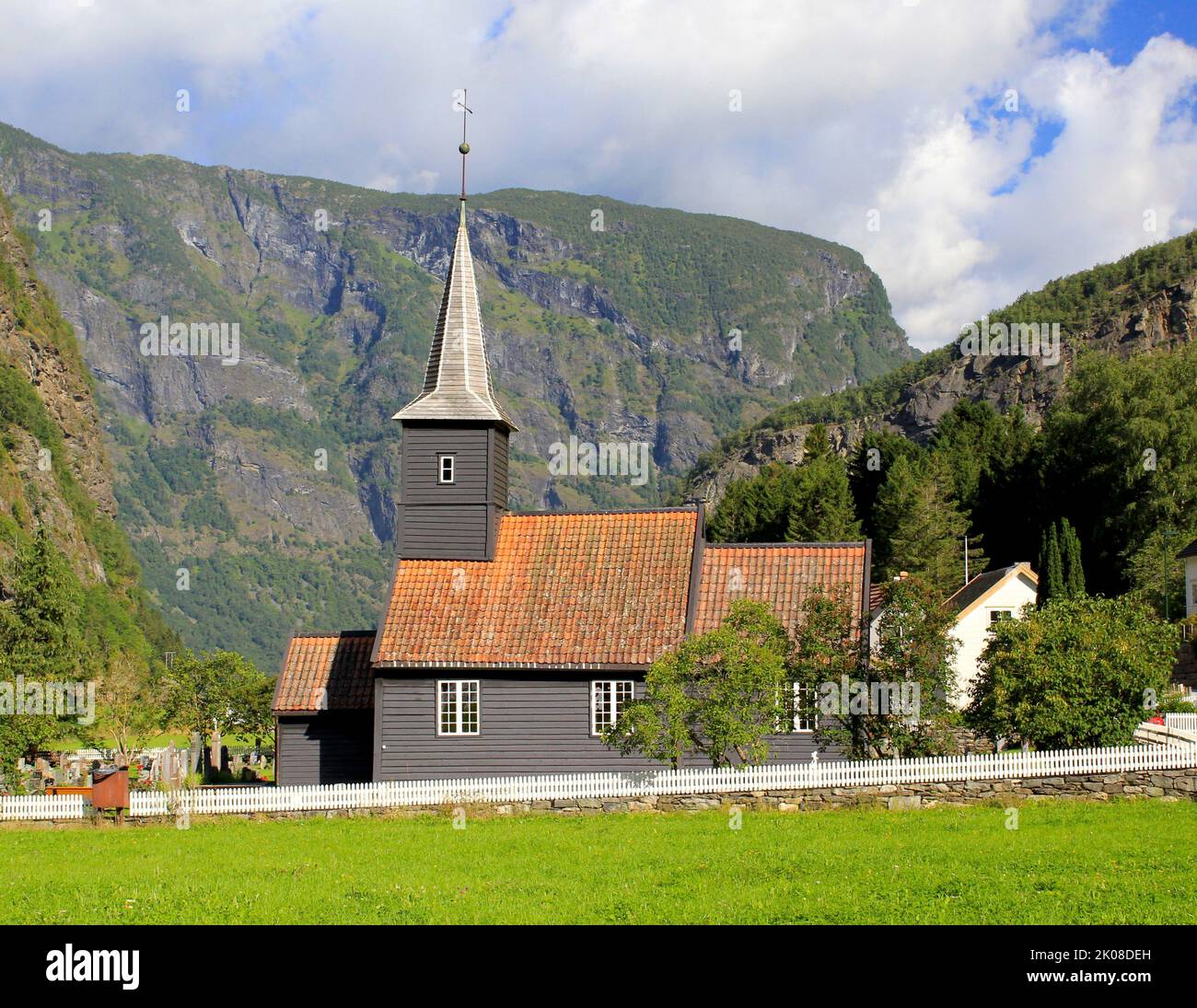 The wooden church set in the beautiful fjord valley in Flam in Norway ...