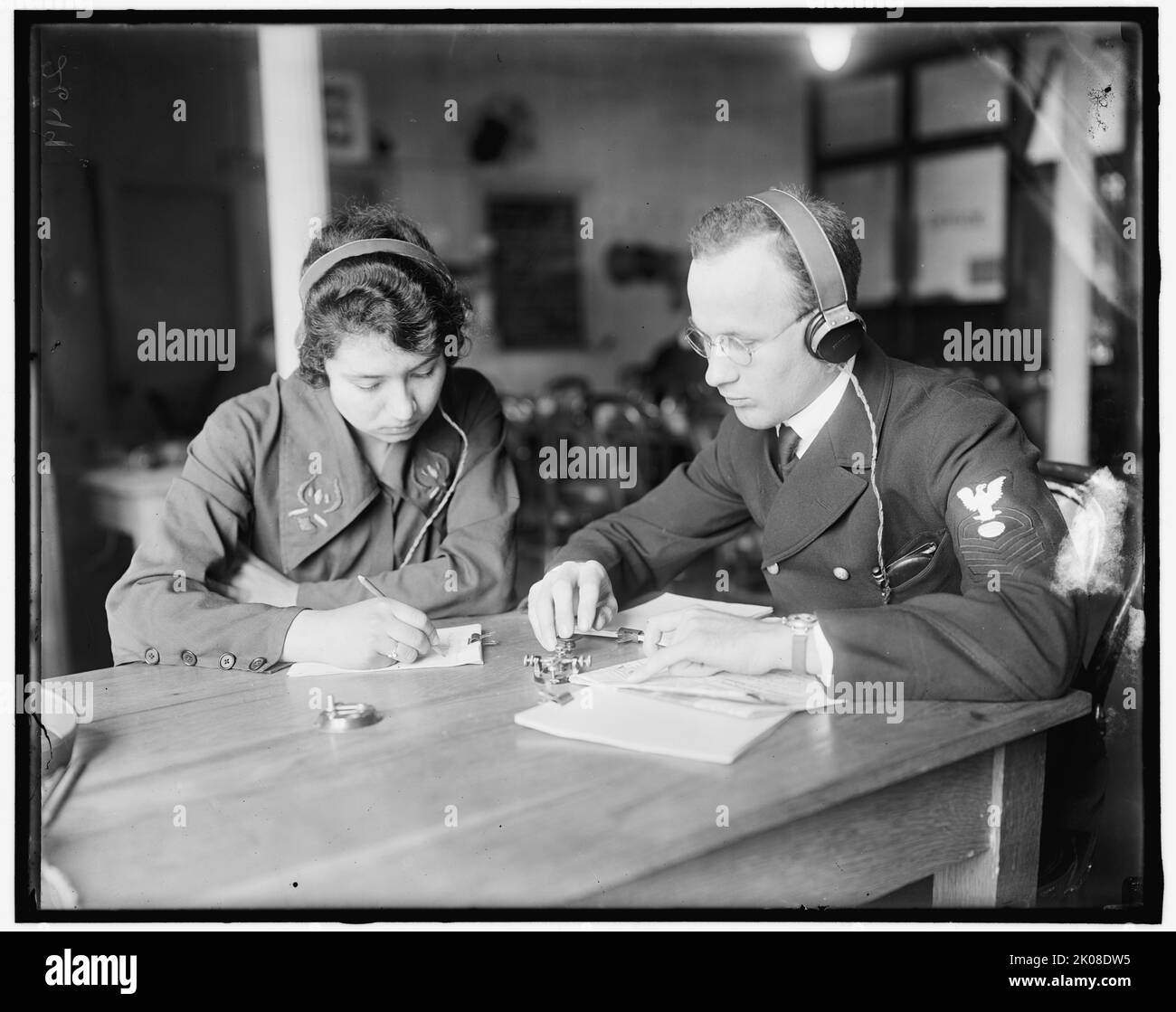 Evelyn Moran, between 1910 and 1920. Woman writing on a pad of paper ...