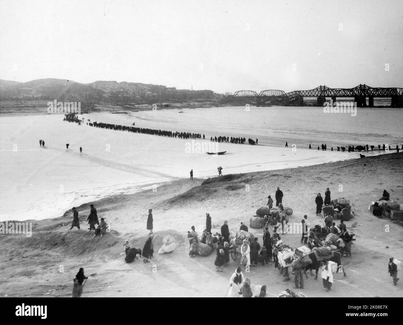 Refugees streaming across the frozen Han River on the ice as they flee ...