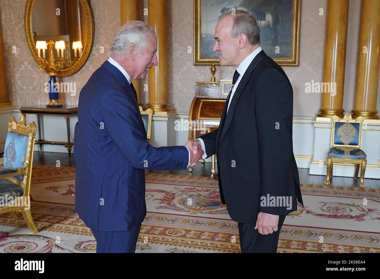 King Charles III shakes hands with Liberal Democrat Leader Sir Ed Davey ...