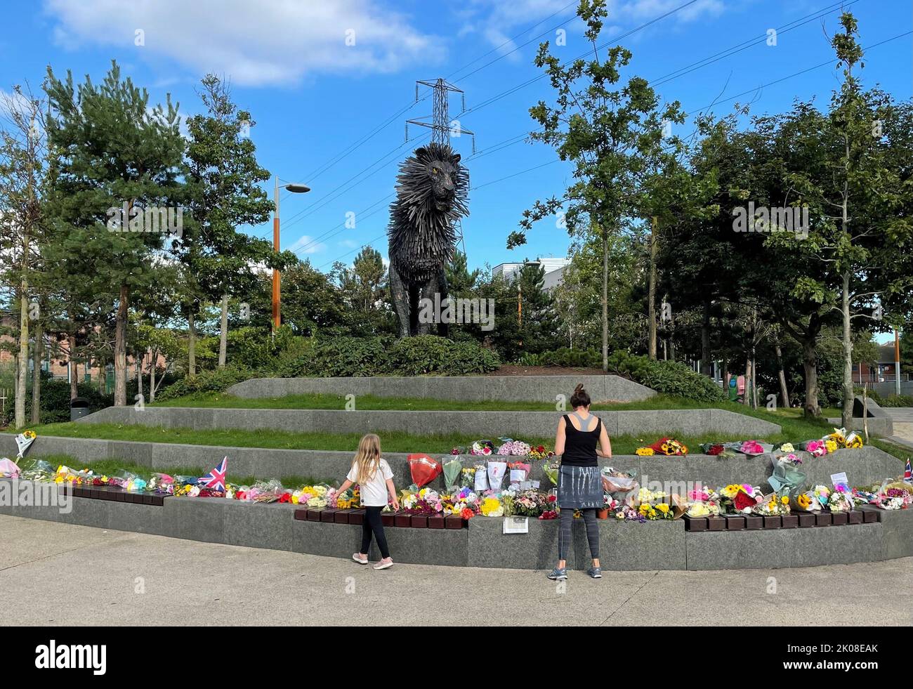 Floral tributes at Aslan statue in CS Lewis Square in east Belfast ...