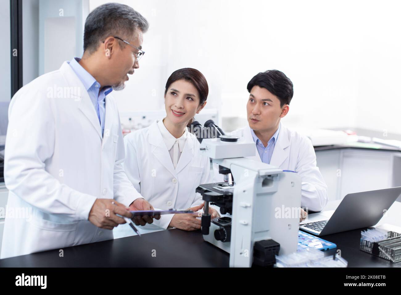 Asian researchers talking hi-res stock photography and images - Alamy
