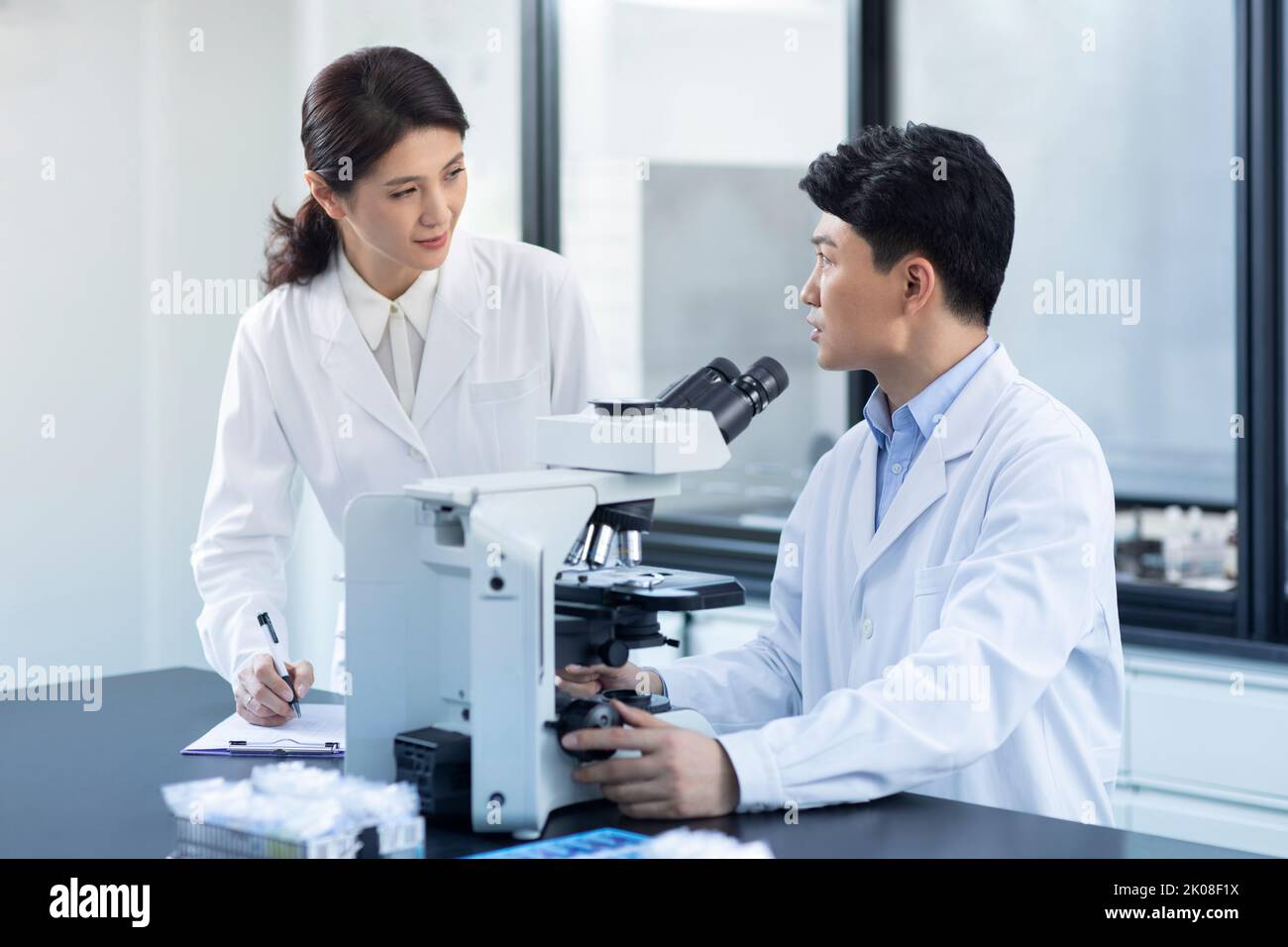 Asian researchers talking hi-res stock photography and images - Alamy