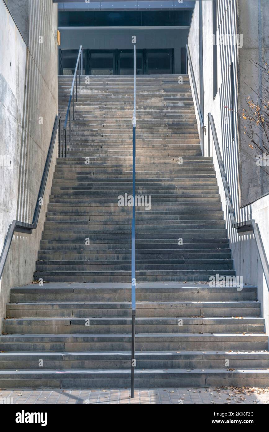 Staircase of a building leading to the upper floor and glass doors ...