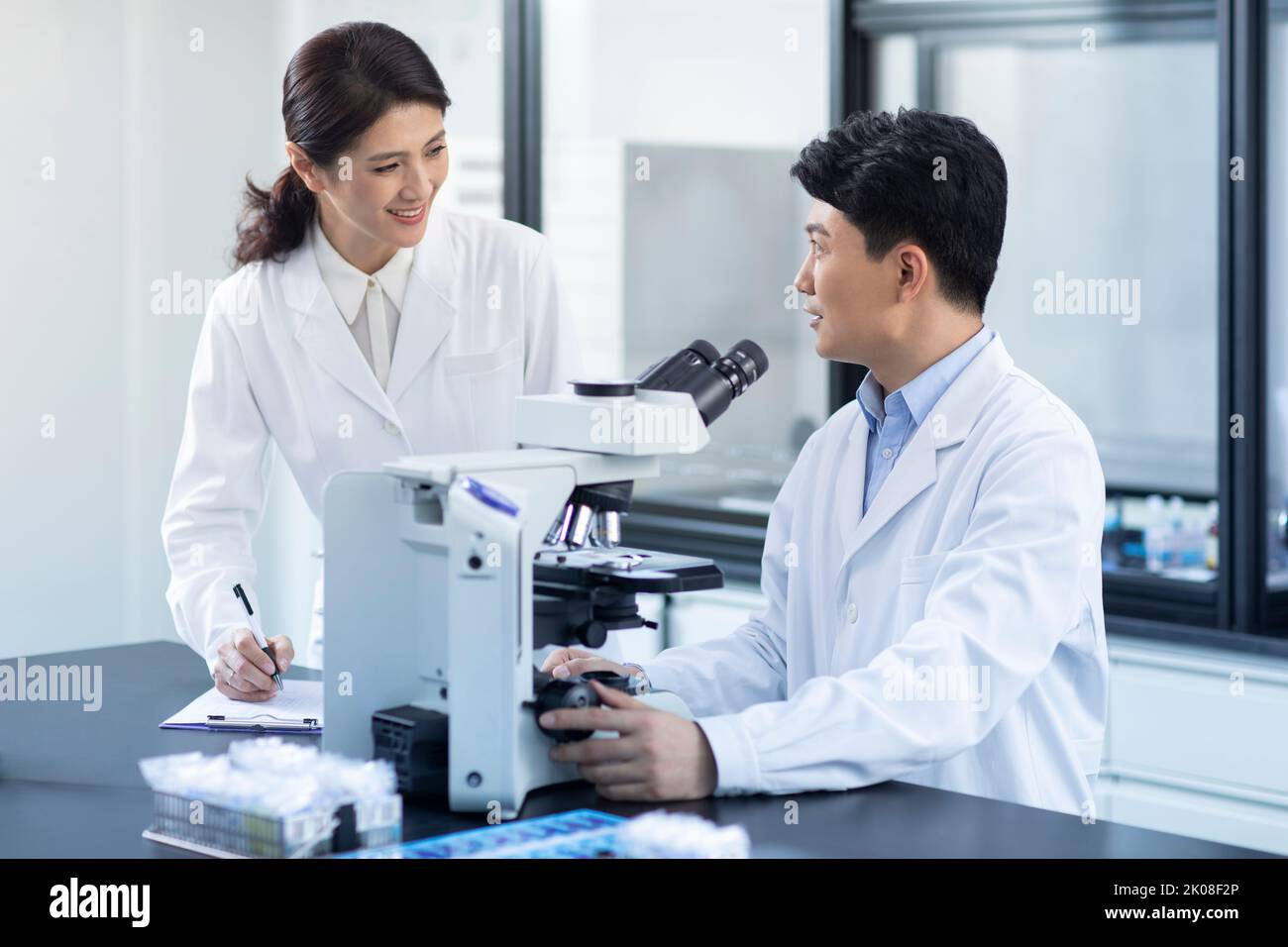 Asian researchers talking hi-res stock photography and images - Alamy