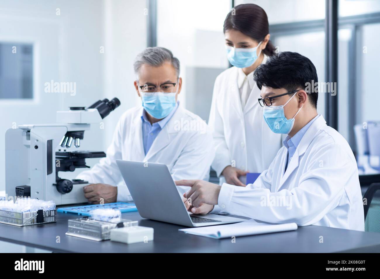 Asian researchers talking hi-res stock photography and images - Alamy