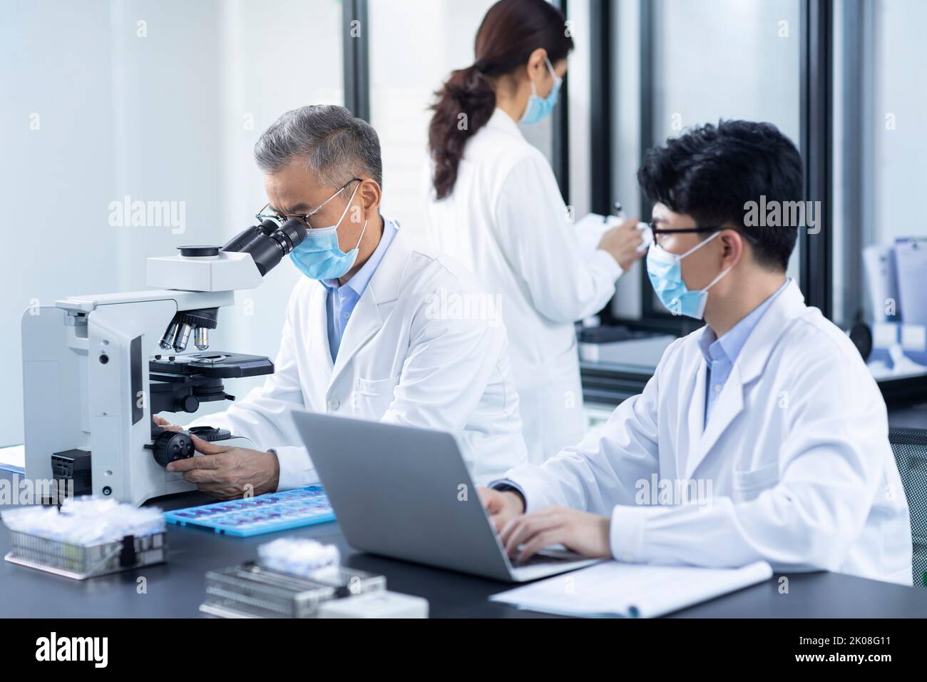 Researchers microscope horizontal hi-res stock photography and images ...