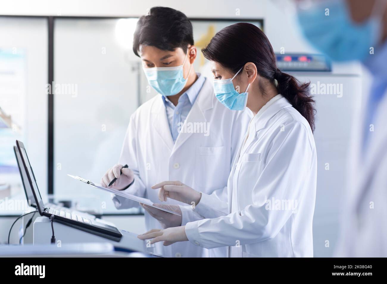 Asian researchers talking hi-res stock photography and images - Alamy