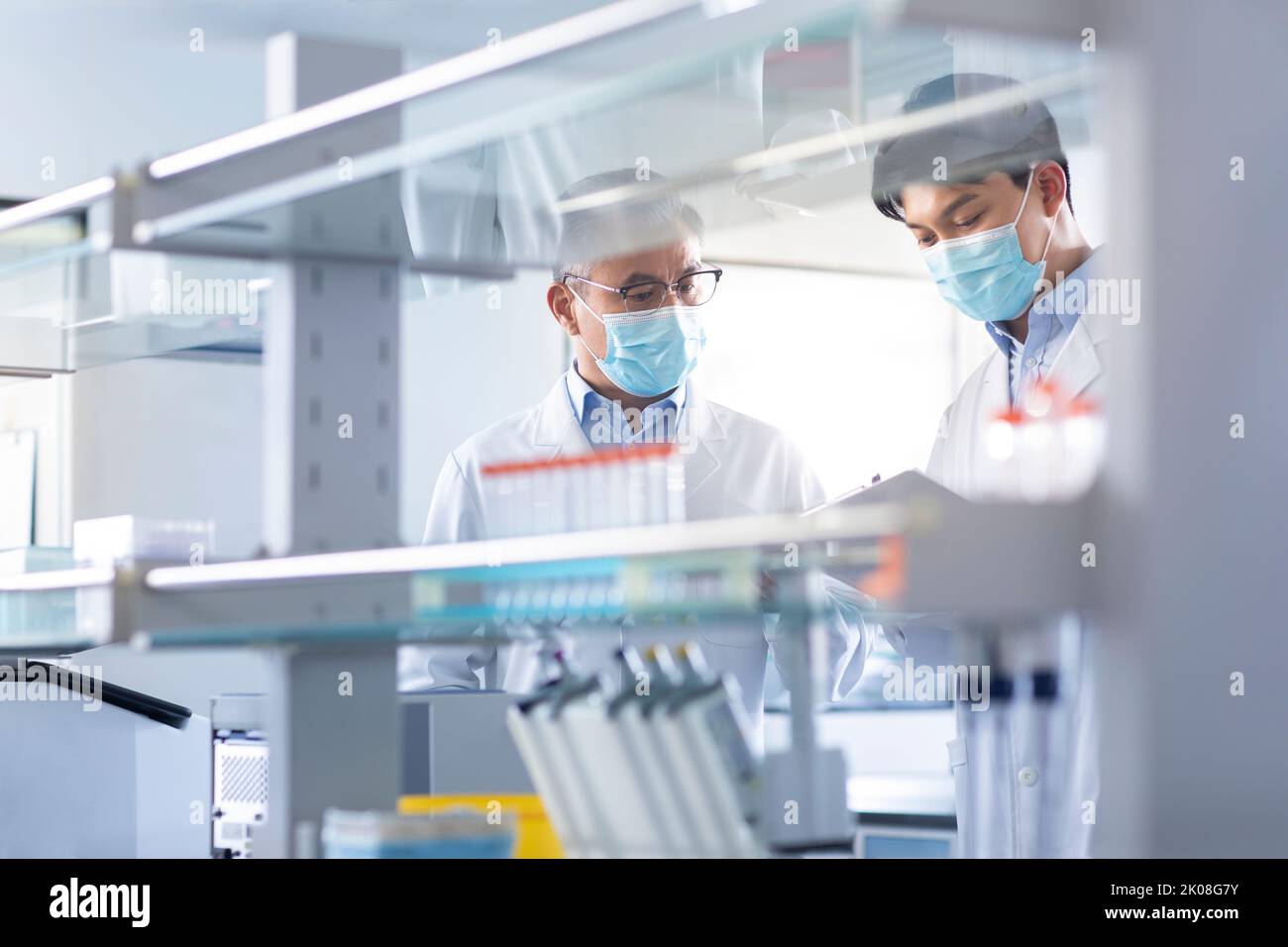 Asian researchers talking hi-res stock photography and images - Alamy