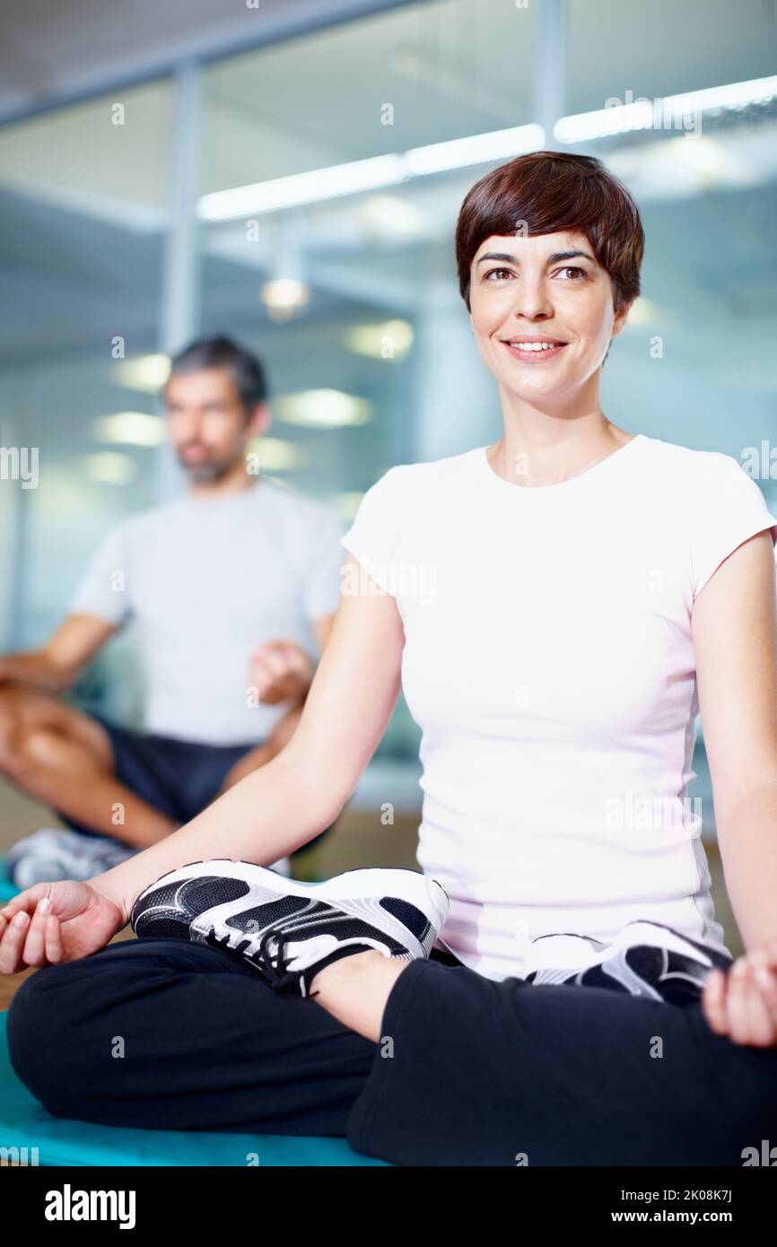 Lotus position. Full length of a beautiful woman in lotus position with ...
