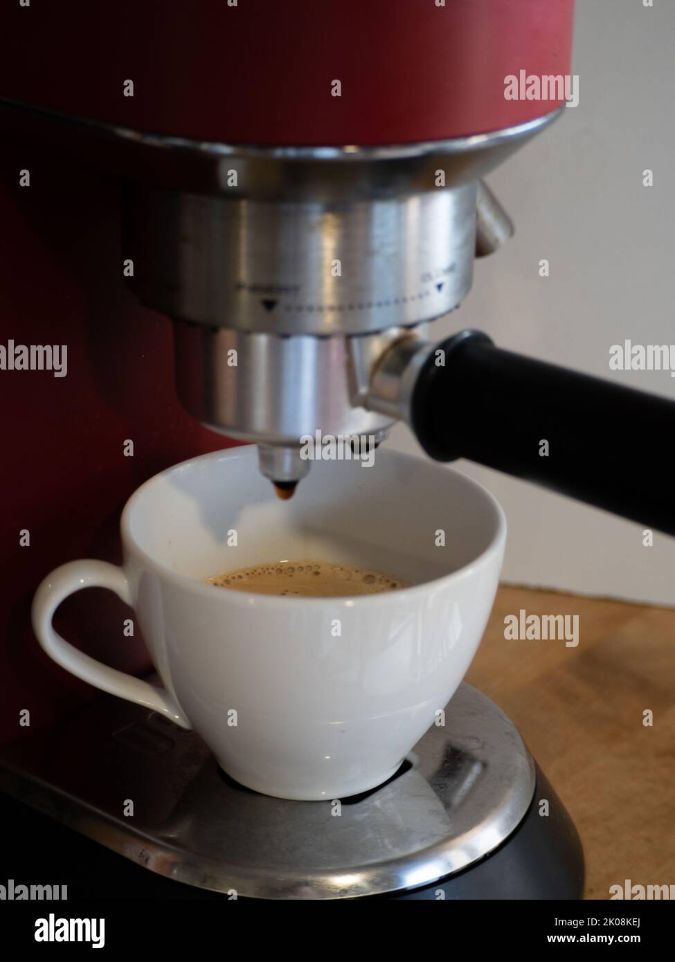 Coffee machine making espresso coffee in a white cup. Top view Stock ...