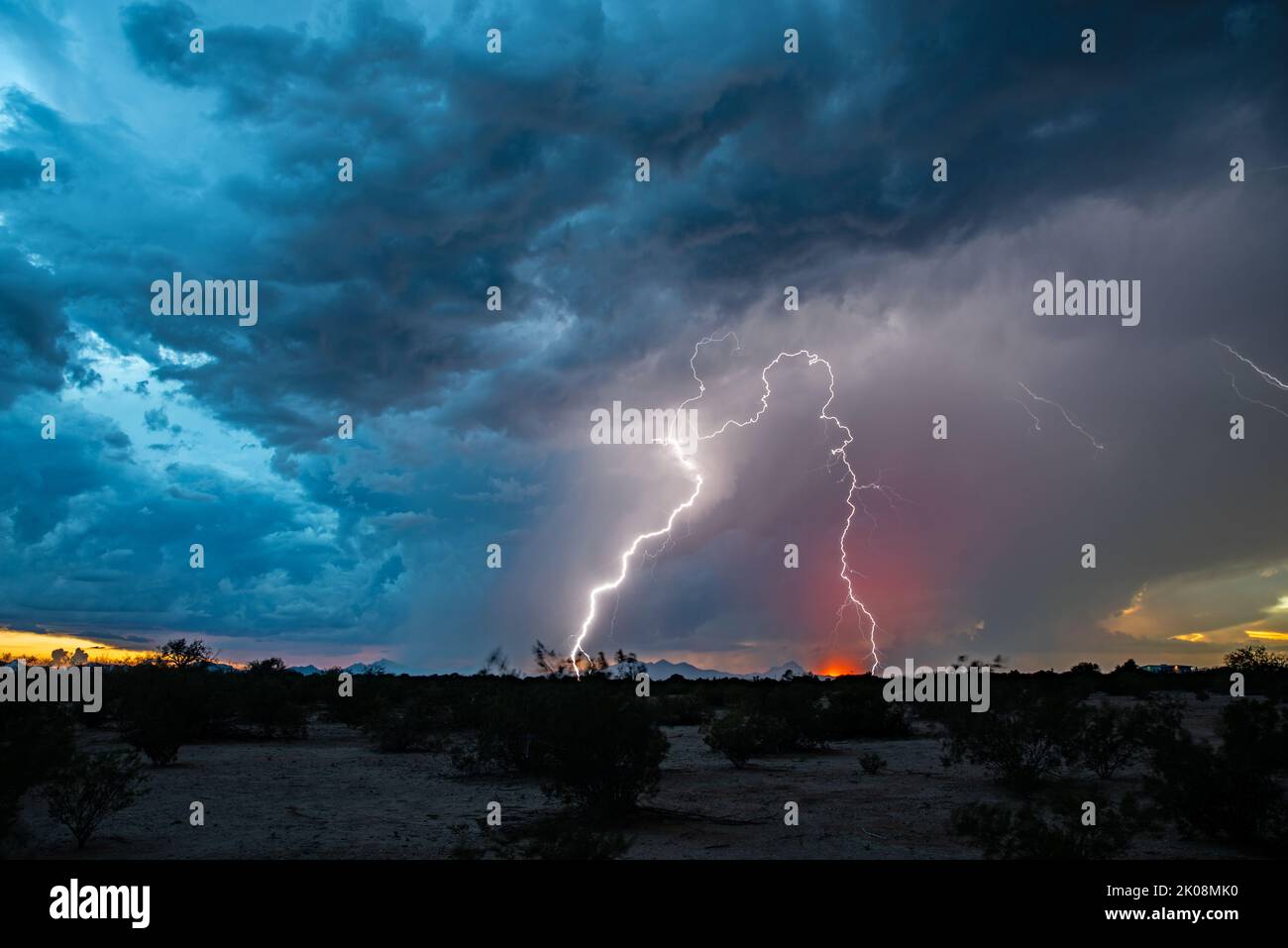 Sunset lightning in the desert Stock Photo - Alamy