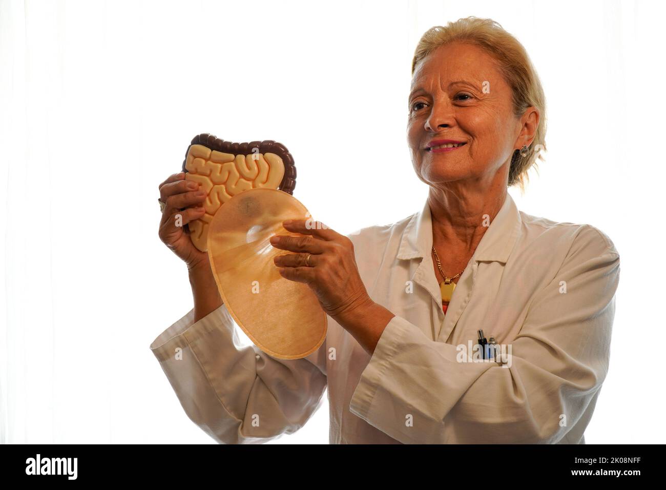 A female doctor with colostomy bag with a plastic intestine Stock Photo ...