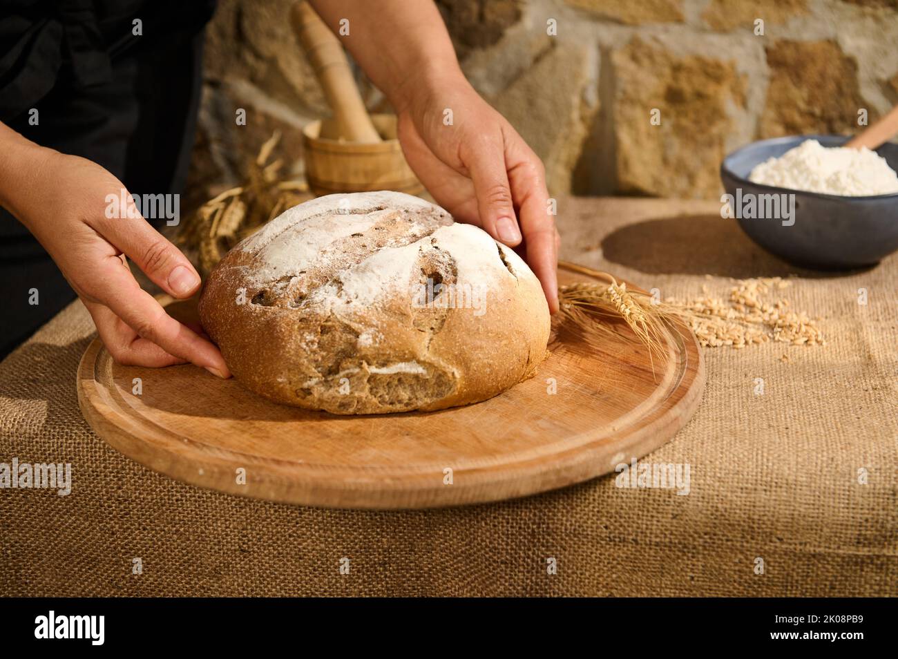 Details: hands on a loaf of warm traditional homemade whole grain ...