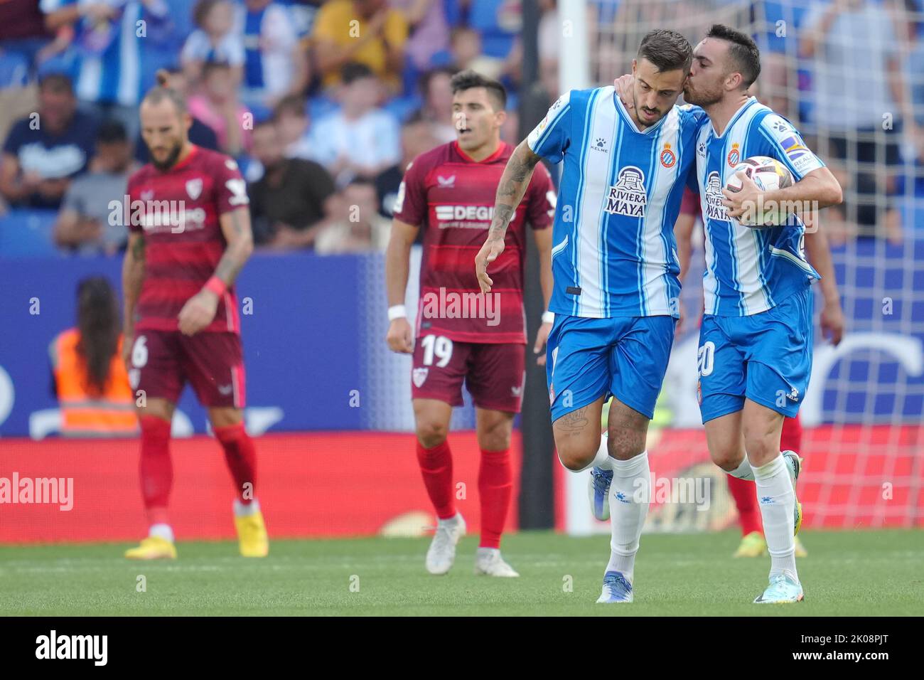 Edu Exposito of RCD Espanyol kisses Joselu Mato of RCD Espanyol after ...