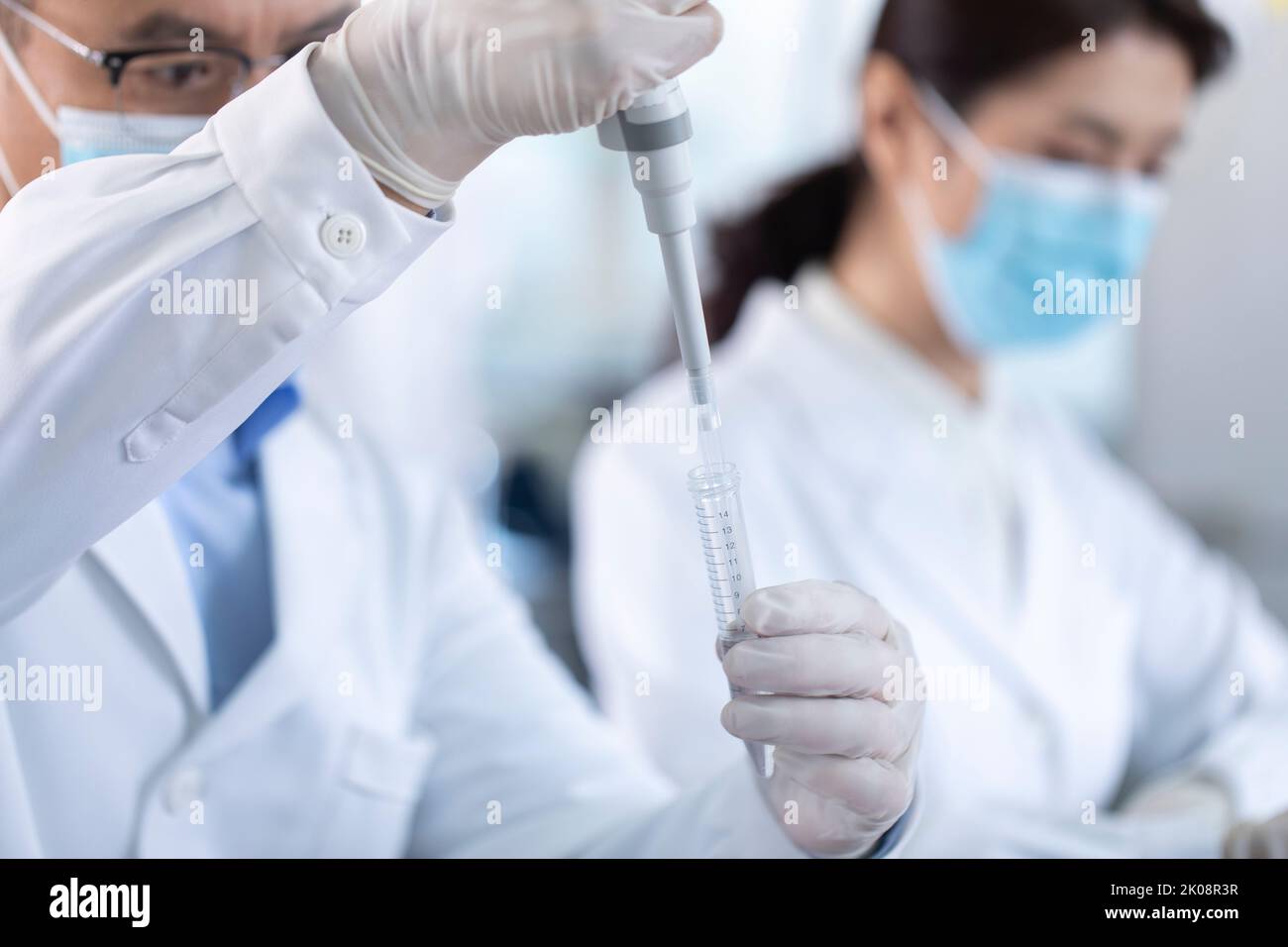 Chinese scientist pipetting samples in laboratory Stock Photo - Alamy