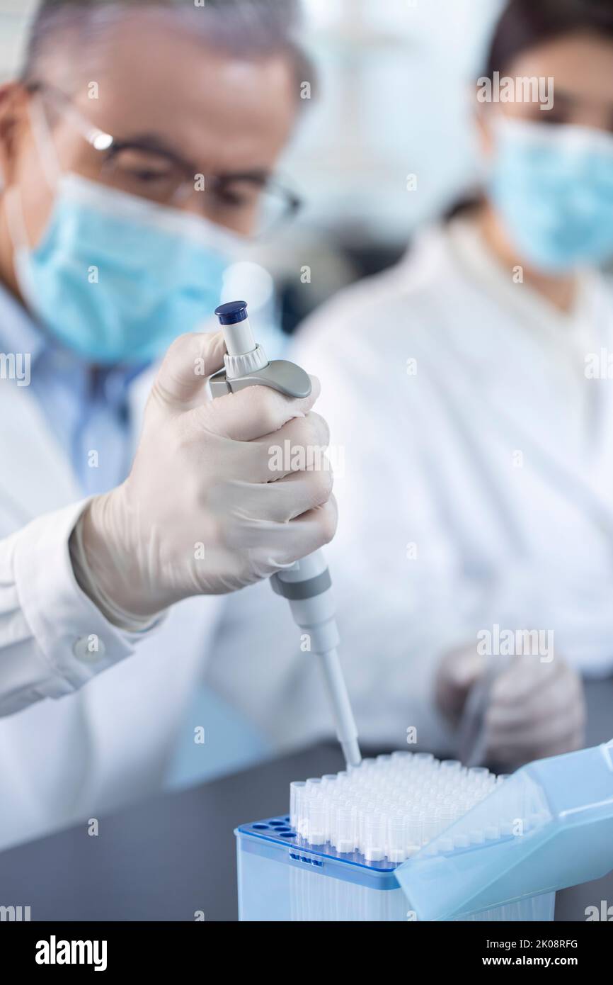 Chinese scientist pipetting samples in laboratory Stock Photo - Alamy
