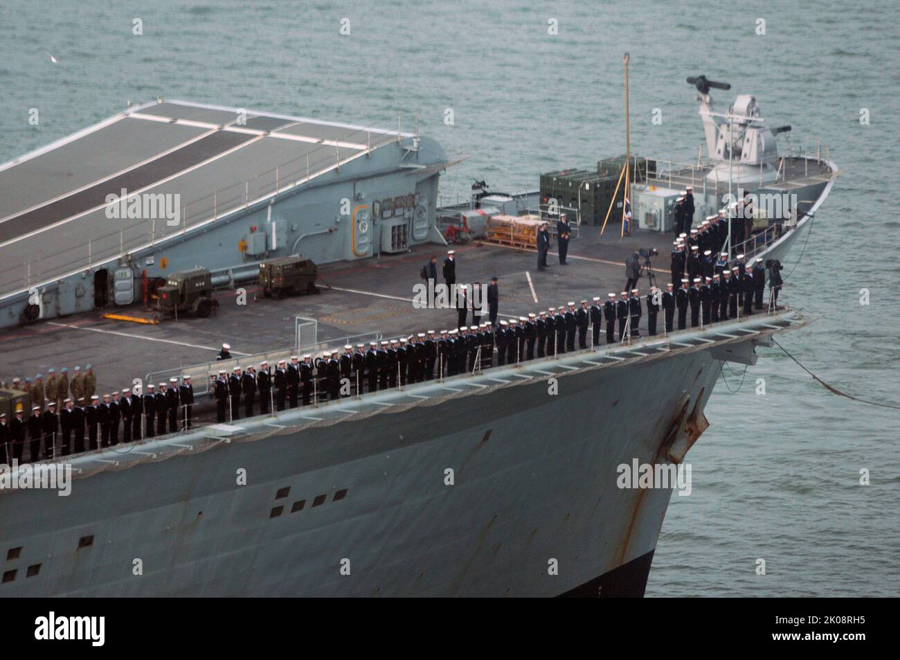 THE CREW LINE THE DECKS AS HMS ILLUSTRIOUS RETURNS TO PORTSMOUTH AFTER ...