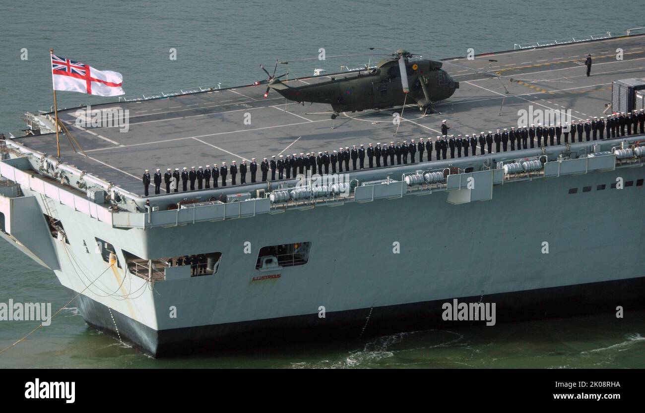 THE CREW LINE THE DECKS AS HMS ILLUSTRIOUS RETURNS TO PORTSMOUTH AFTER ...