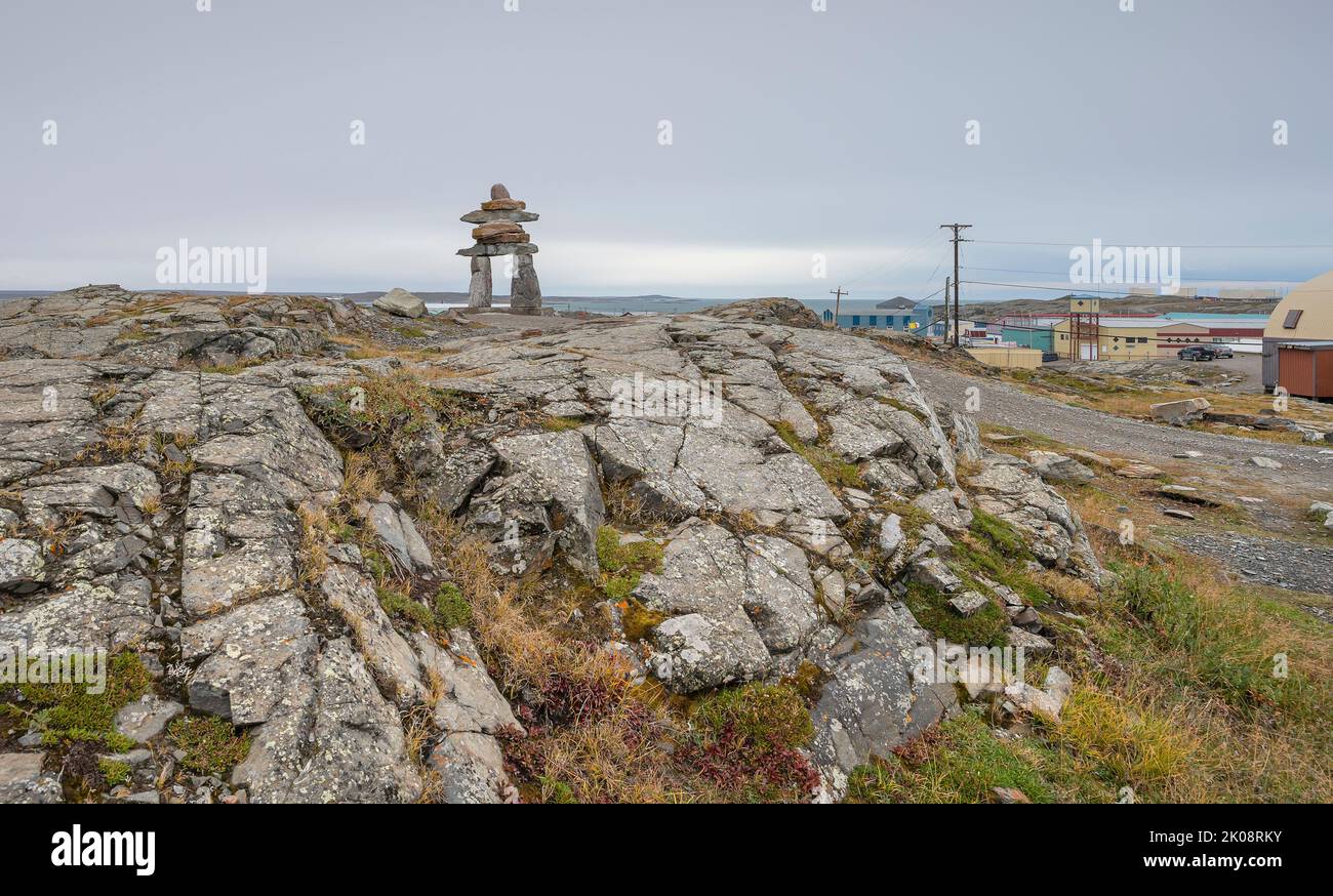 Inukshuk (Inuksuk) on hilltop at the entrance to Rankin Inlet on the ...