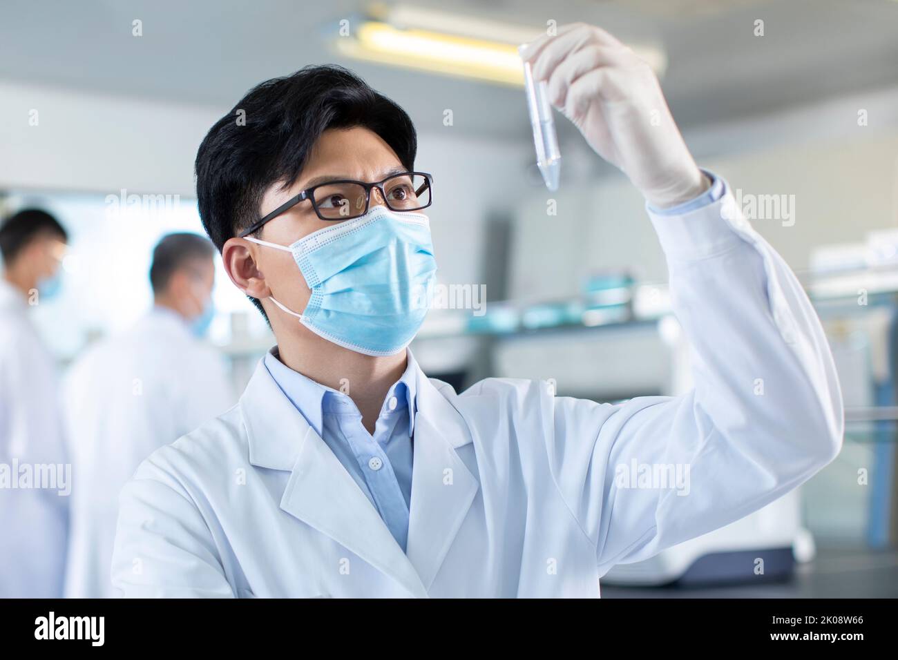 Chinese scientists examining medical sample in laboratory Stock Photo ...