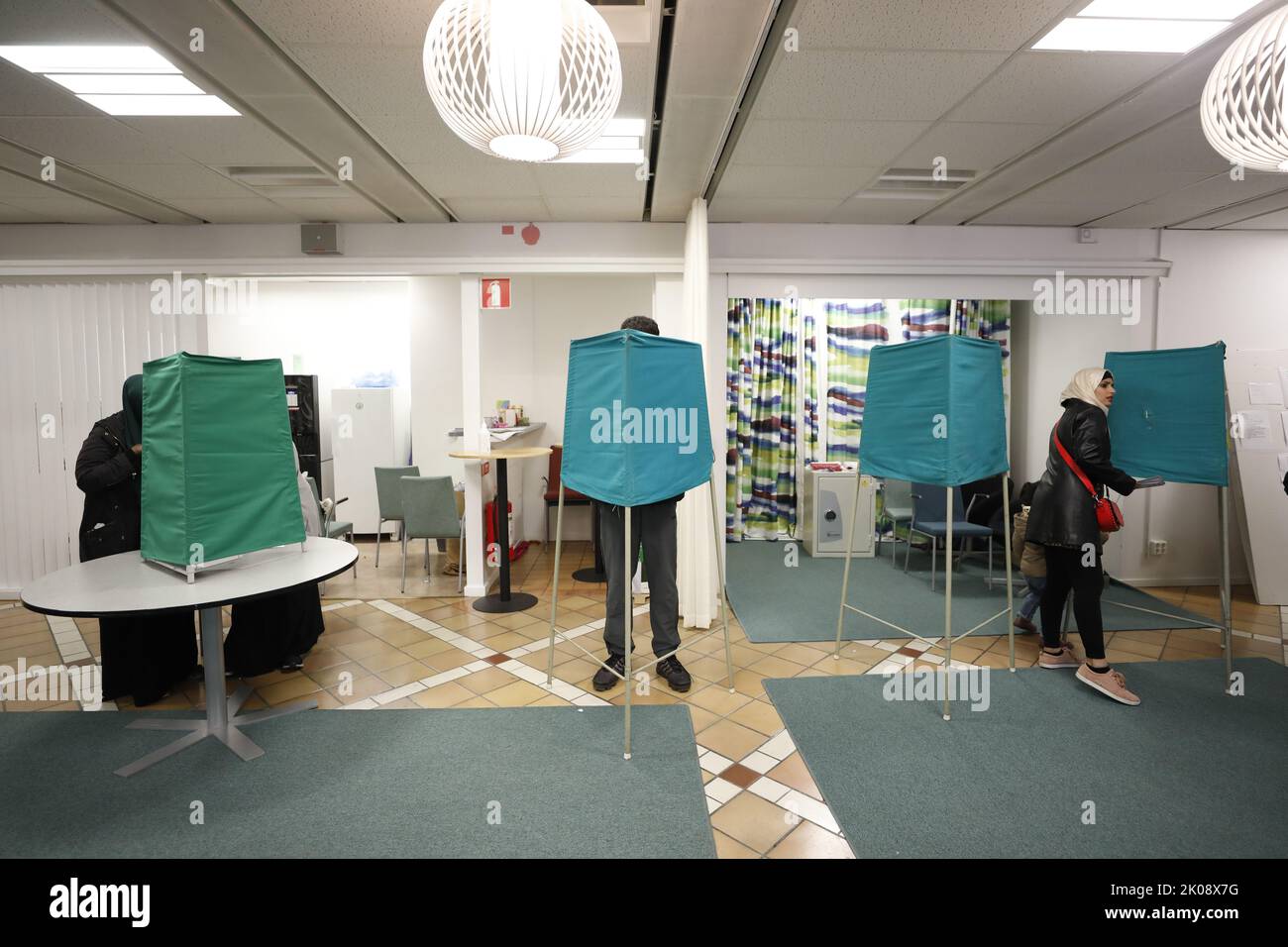 People cast their votes at a polling station for advanced voting in the ...