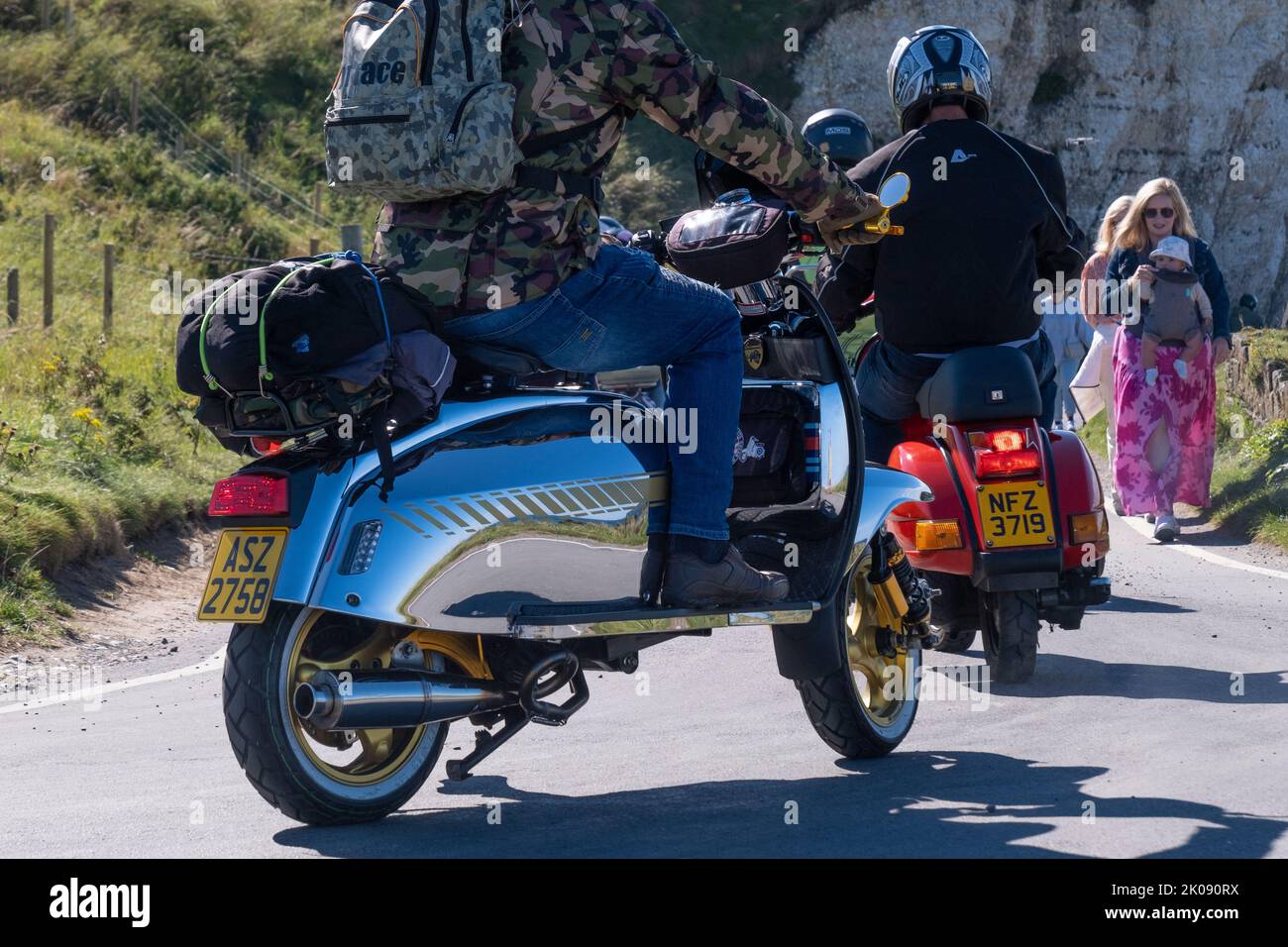 Scomadi Scooter with gleaming chrome on the winding road to harbour ...