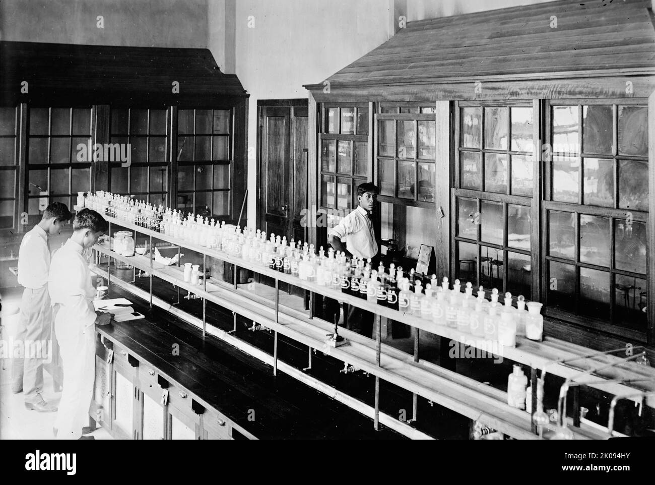 Philippines, 1912. [Young men in laboratory] Stock Photo - Alamy