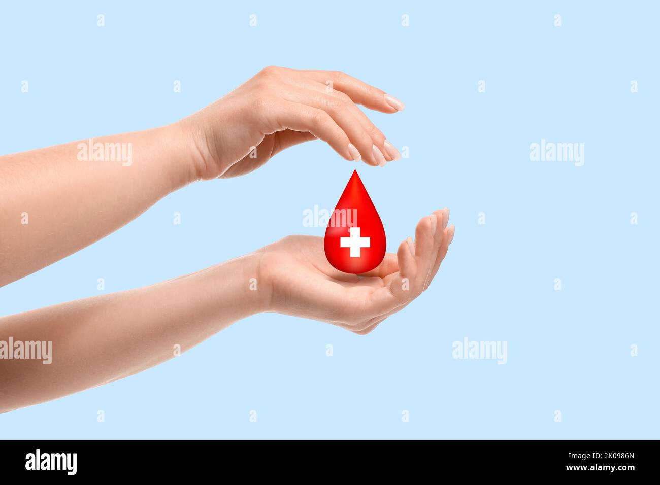 Female hands and drop of blood on light blue background Stock Photo - Alamy