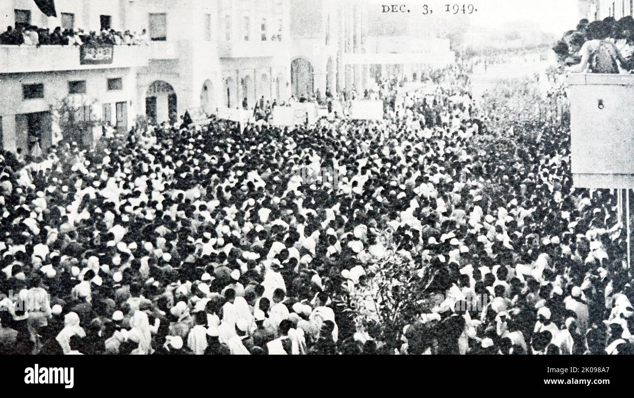 Newspaper photograph of crowds celebrating in Tripoli following the ...