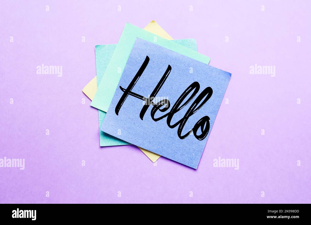 Sticky note with word HELLO on lilac background Stock Photo - Alamy