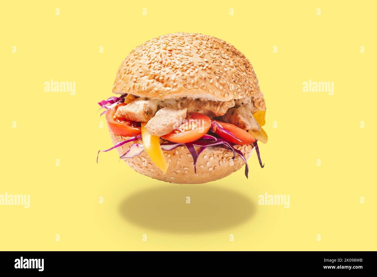 Tasty doner kebab in bun on yellow background Stock Photo - Alamy